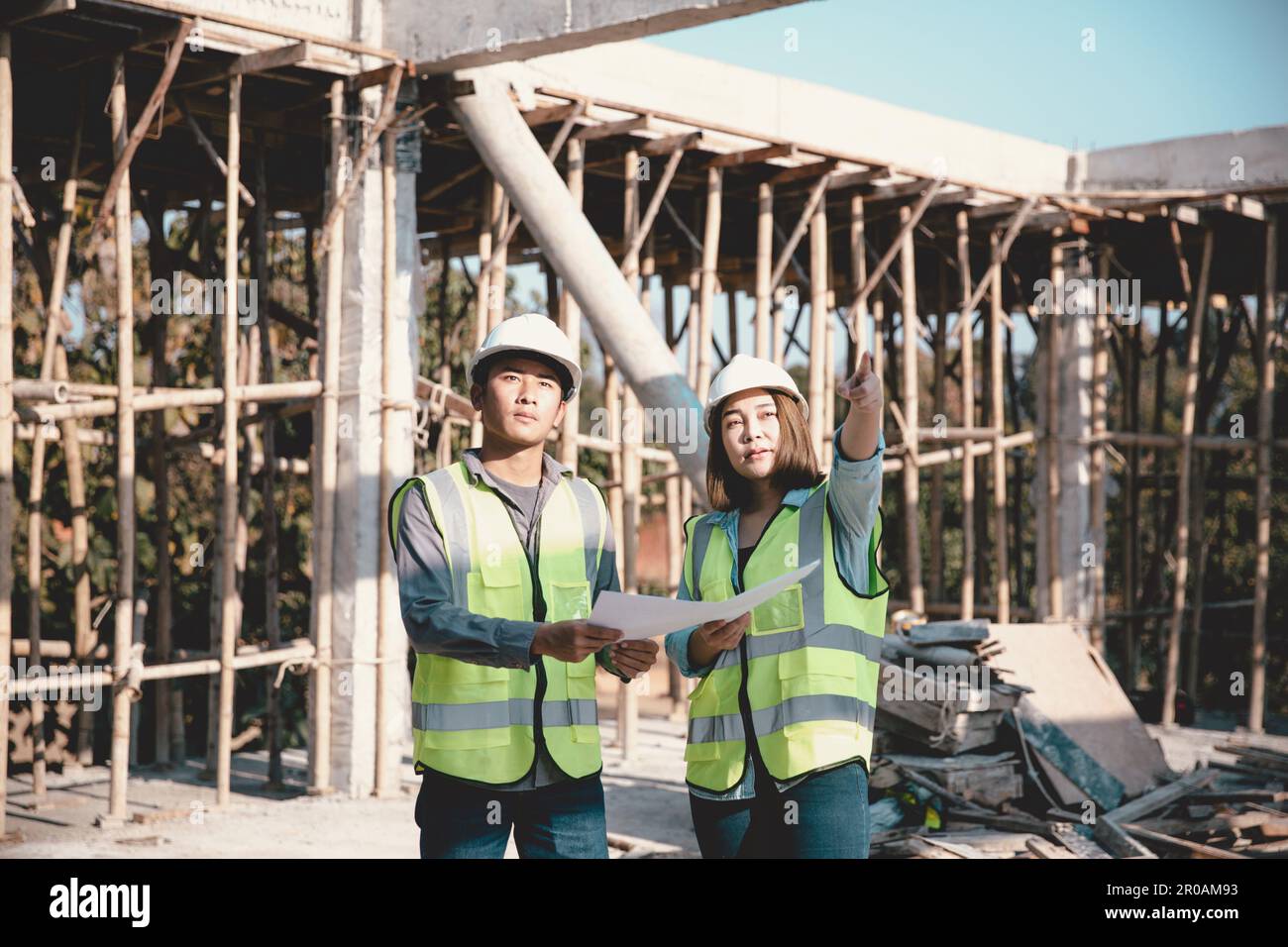Two specialists inspect commercial, Industrial building construction ...