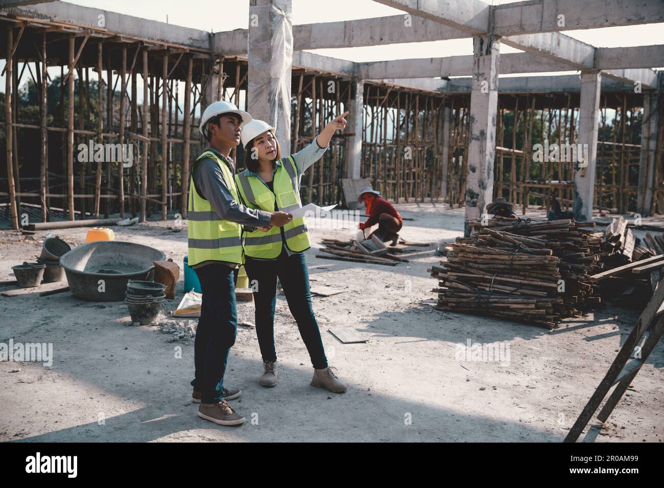Two specialists inspect commercial, Industrial building construction ...