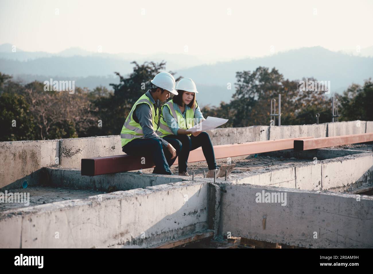 Two specialists inspect commercial, Industrial building construction ...