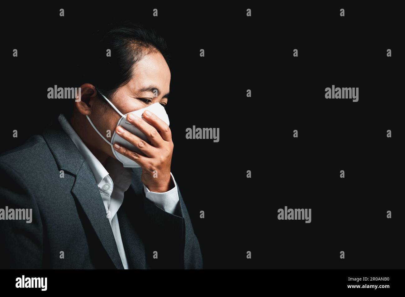 Woman wearing N95 PM 2.5 respiratory protection mask against air ...