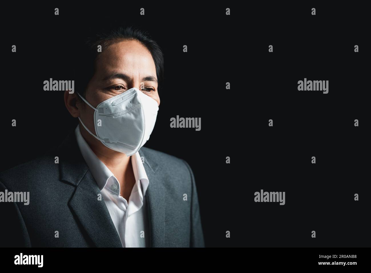 Woman wearing N95 PM 2.5 respiratory protection mask against air ...