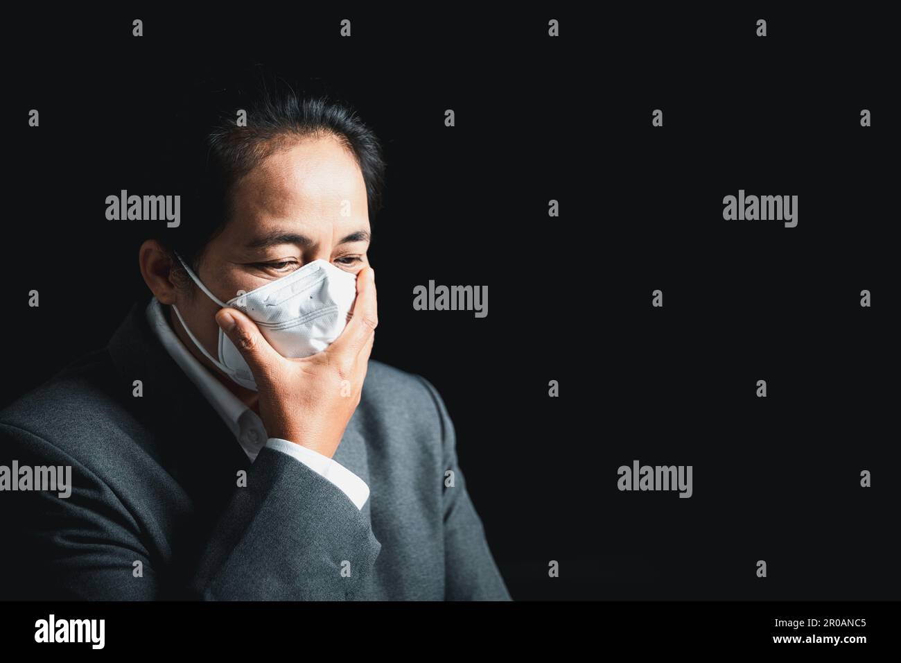 Woman wearing N95 PM 2.5 respiratory protection mask against air ...