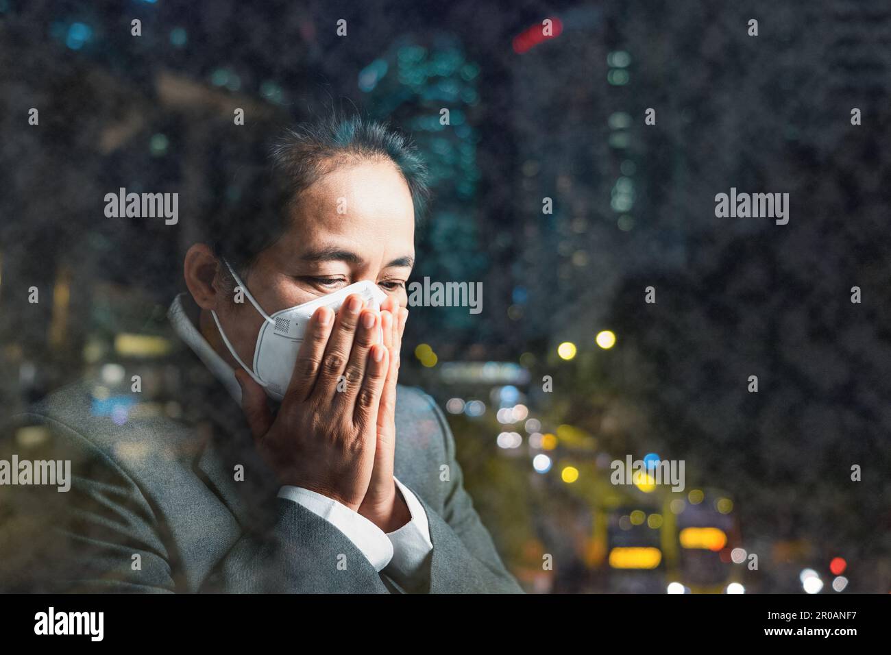 Woman wearing N95 PM 2.5 respiratory protection mask against air ...