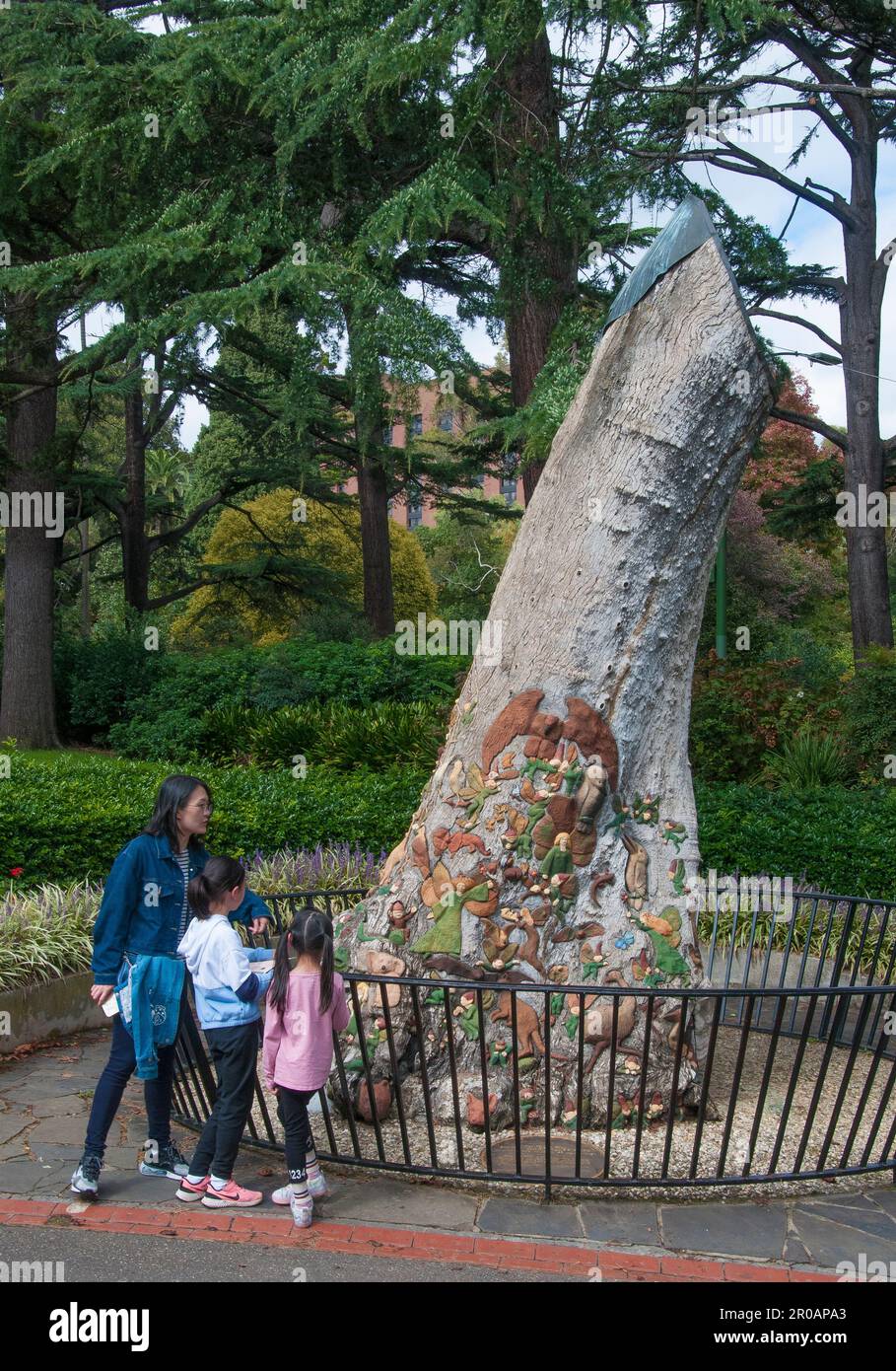 Mother and children admiring the Fairies Tree created by artist and ...