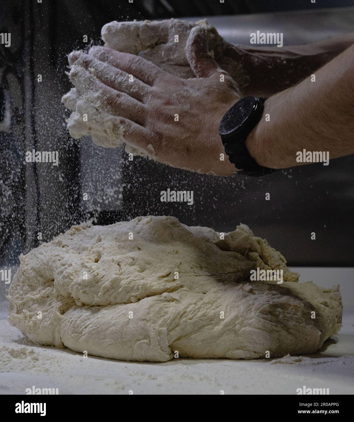 White flour flies in the air on kitchen background Stock Photo - Alamy