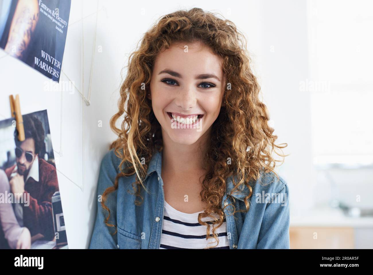 Following a career in graphic design. A young graphic designer smiling ...