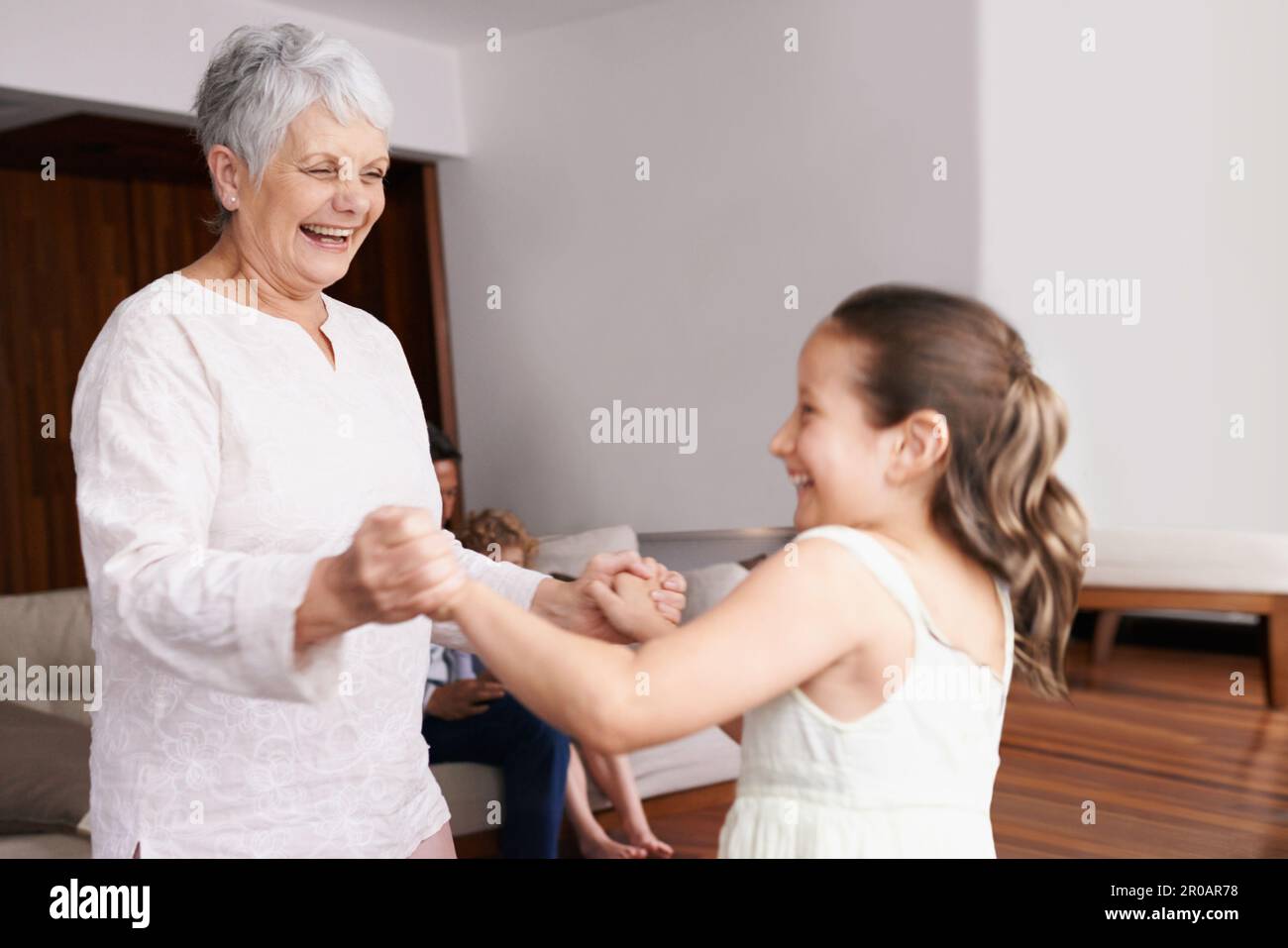 Holding hands, dance or happy grandmother with a child playing or ...