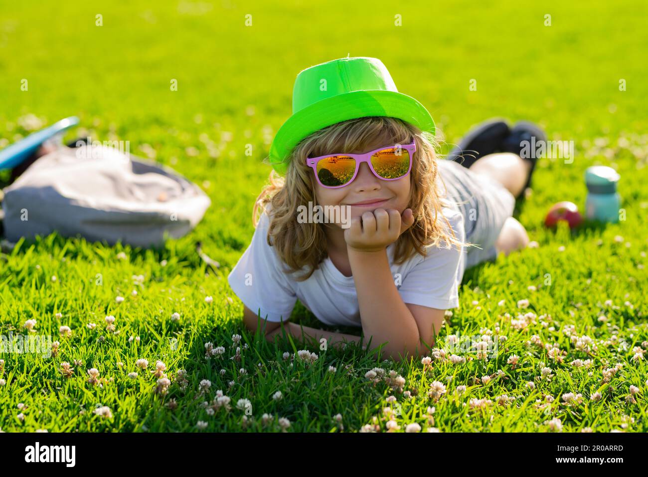 Kid summer. Happy child enjoying on grass field and dreaming. Summer ...