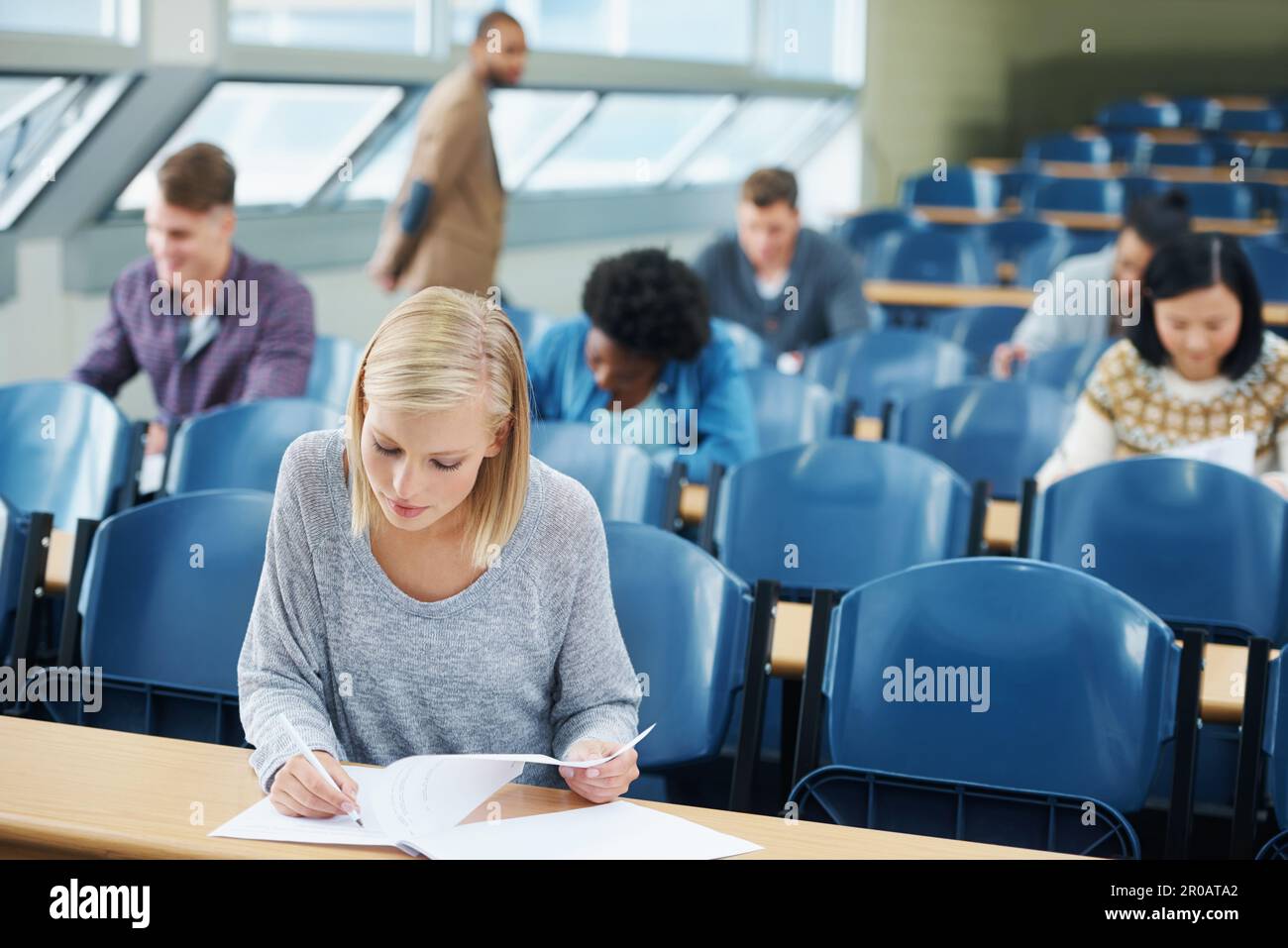 Ready to ace the midterms. university students in a classroom Stock ...