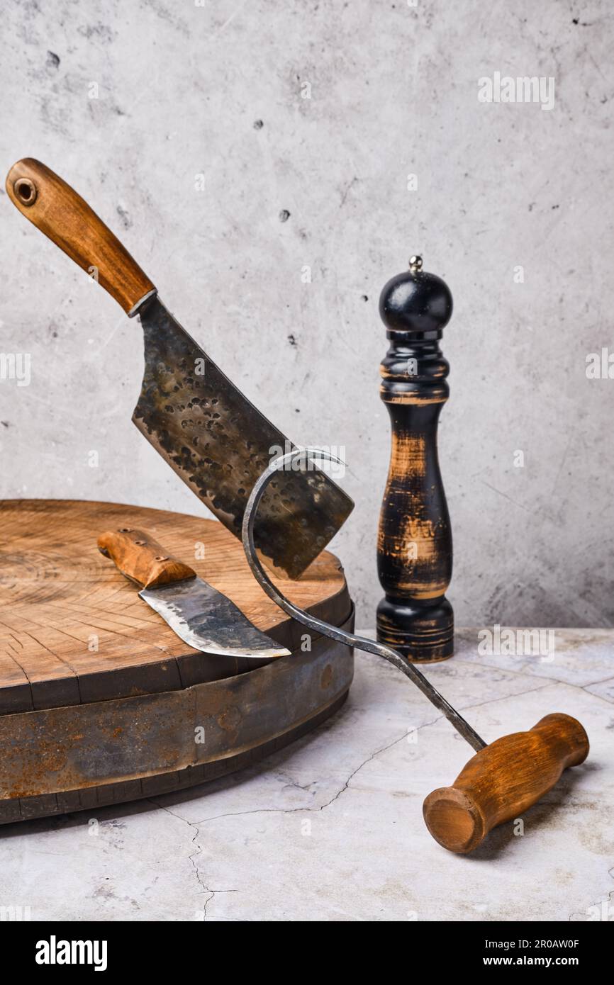 Different kinds of butcher tools forged by blacksmith Stock Photo - Alamy