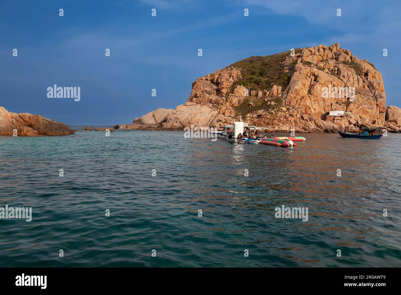 Rocky coastal of island Hon Tai, in the Bay of Mui Ca Heo, Vinh Hy ...