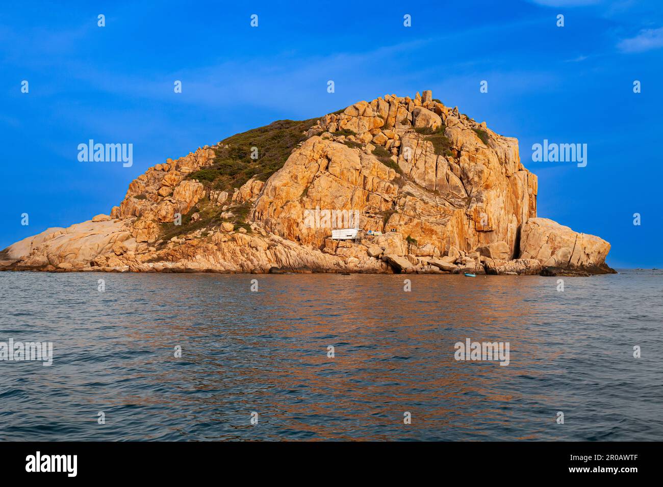 Rocky coastal of island Hon Tai, in the Bay of Mui Ca Heo, Vinh Hy ...