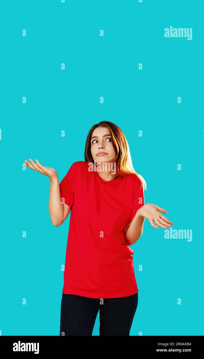 Whatever gesture clueless woman shrug shoulders Stock Photo - Alamy