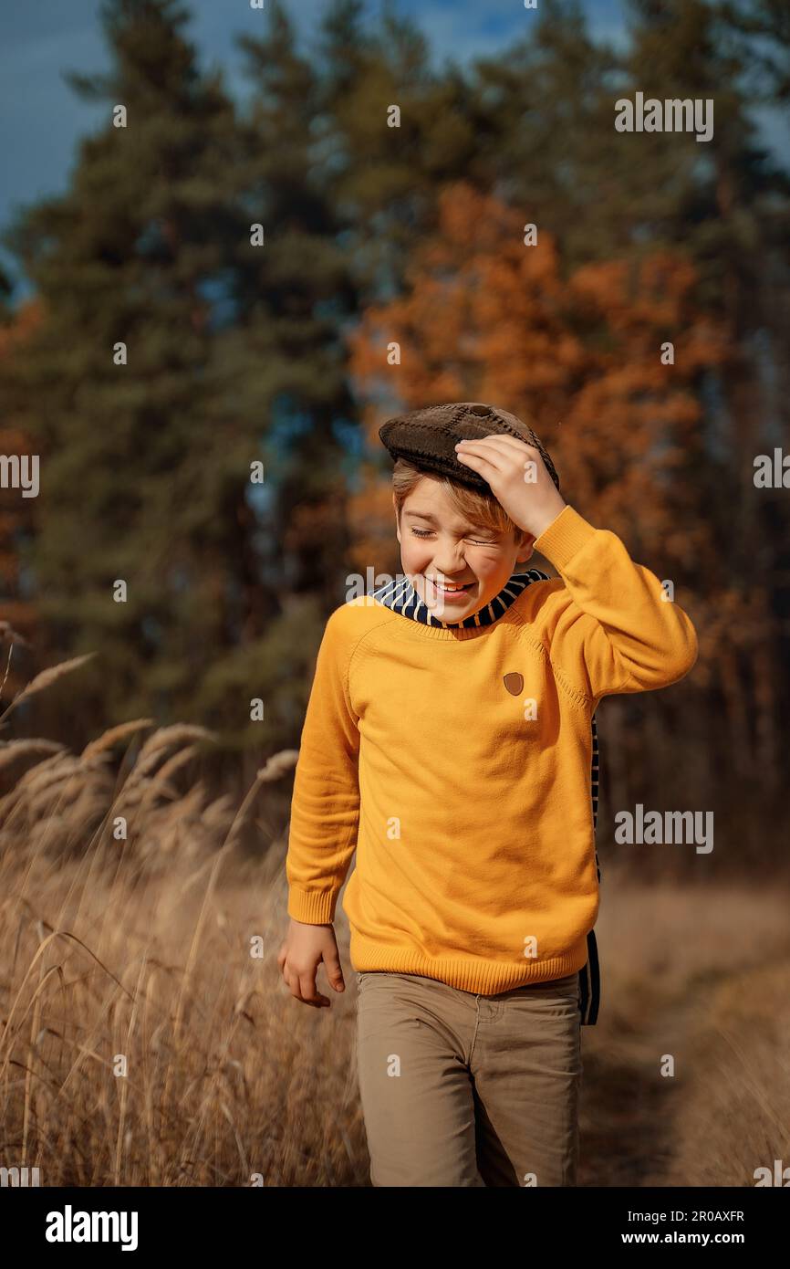 Children's fashion, retro style. A smiling little boy in a retro style ...