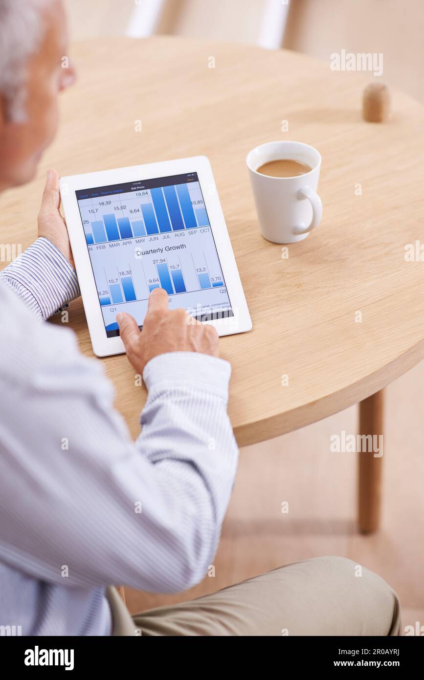 Now thats business savvy. a businessman pointing at figures on his ...