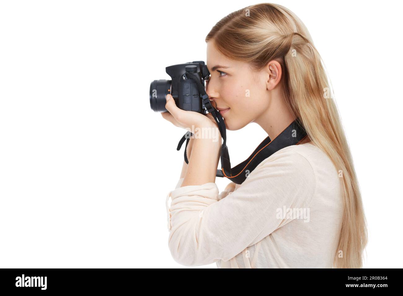 Click. Studio shot of a beautiful young woman taking pictures with her ...