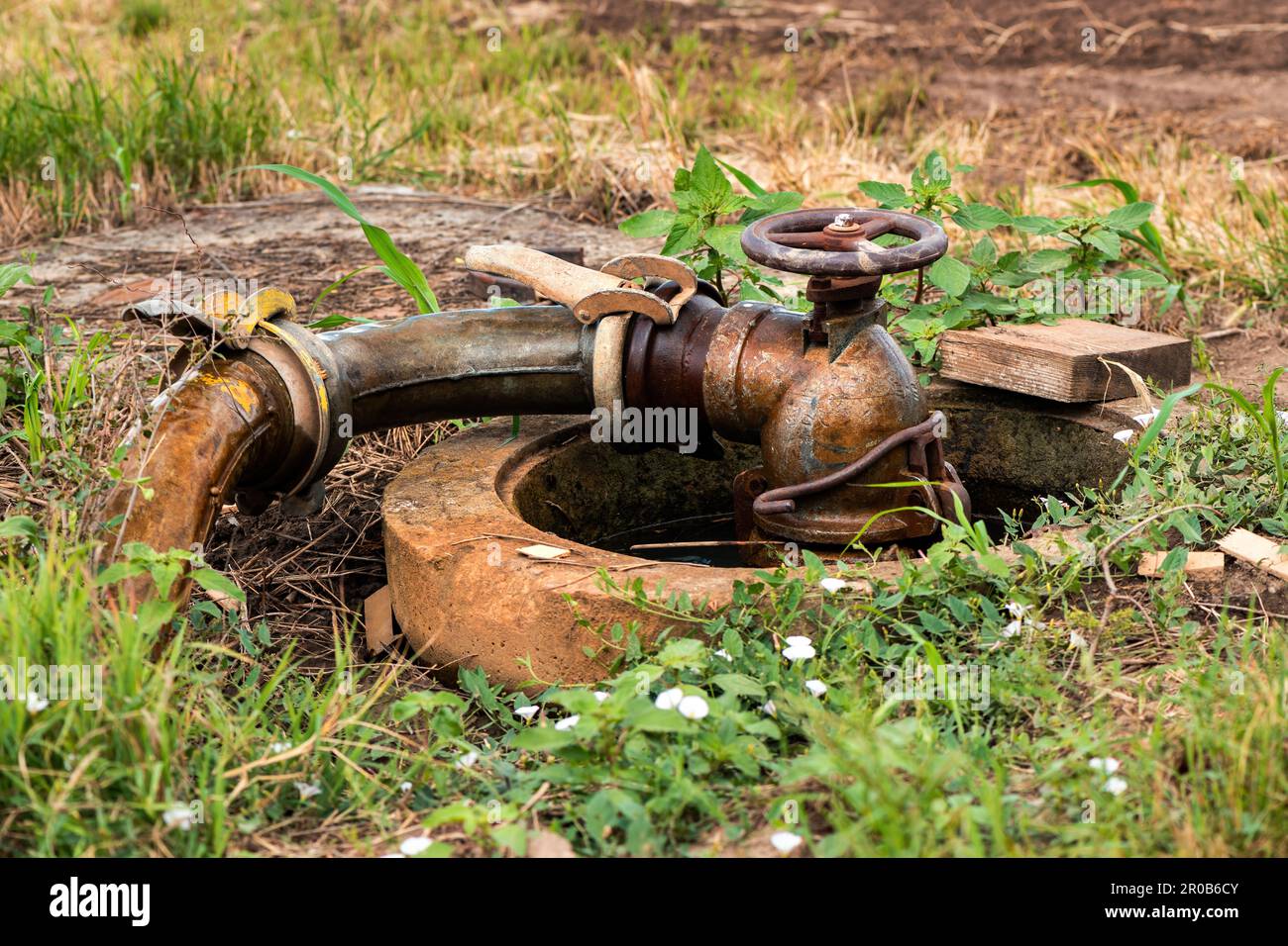 Agriculture irrigation pump station valve in field, selective focus ...