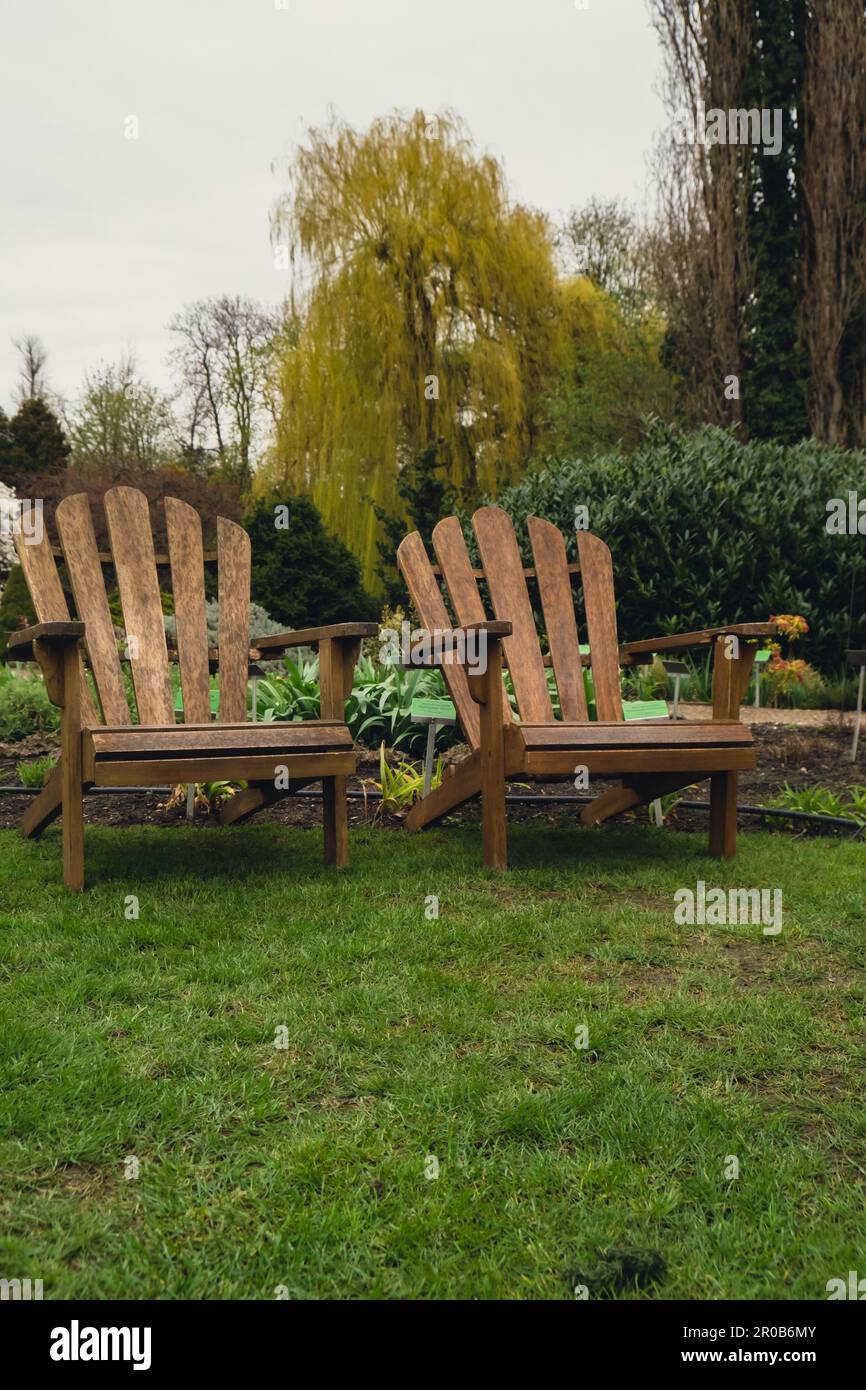 Two Wooden lounges chairs placed on spacious terrace of modern country ...