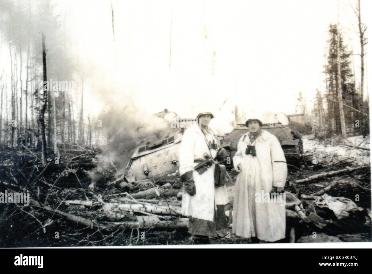 World War Two B&W photo Two German Soldiers in Snow Camo beside wrecked ...