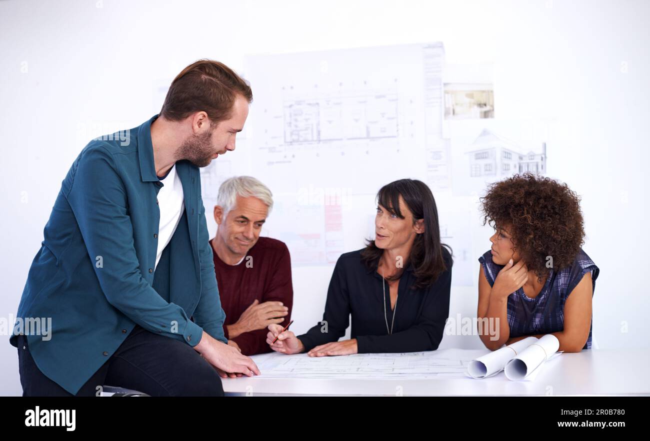 Going over the nuts and bolts of their design. a group of architects ...