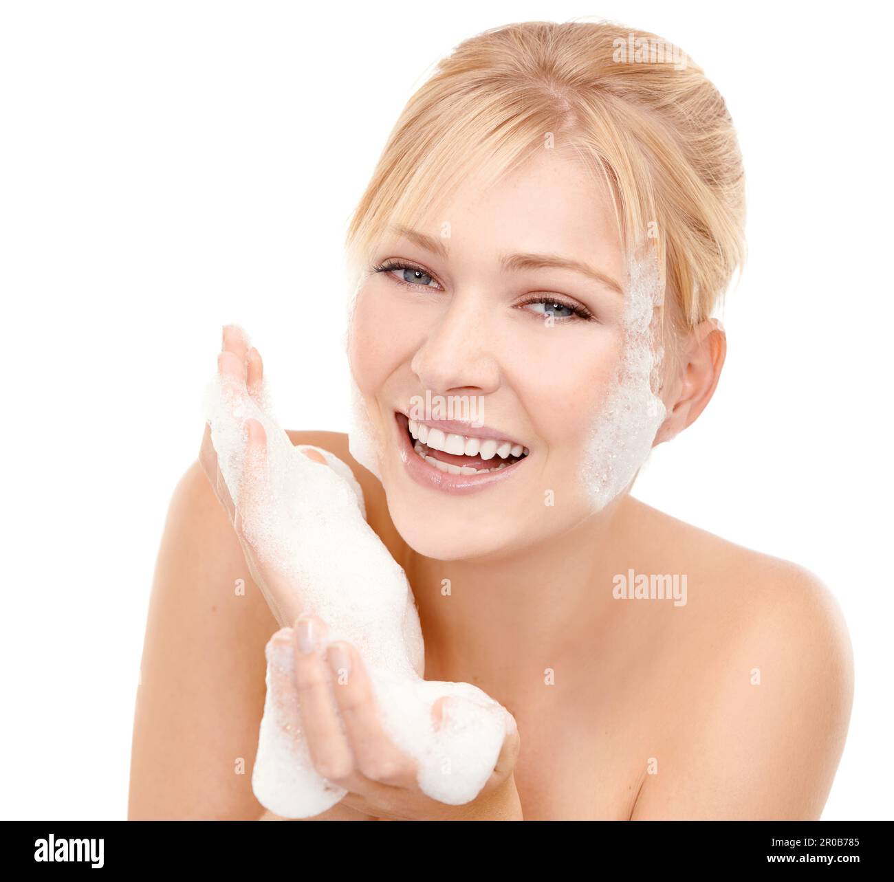 Who said skin care had to be boring...Portrait of a young woman playing ...