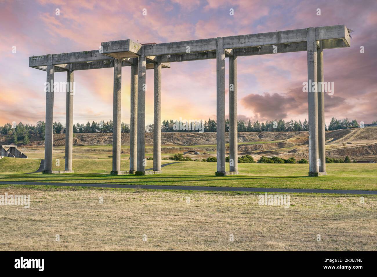 An array of towering concrete pillars arranged in a linear formation in ...