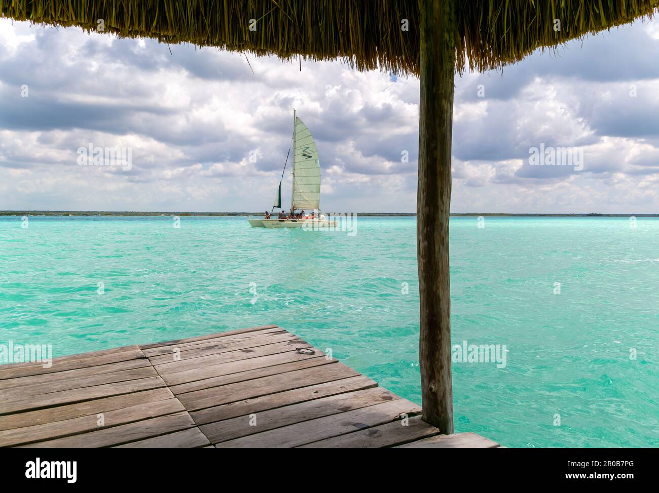 Sailing boat on clear turquoise water of Lake Bacalar, Bacalar ...