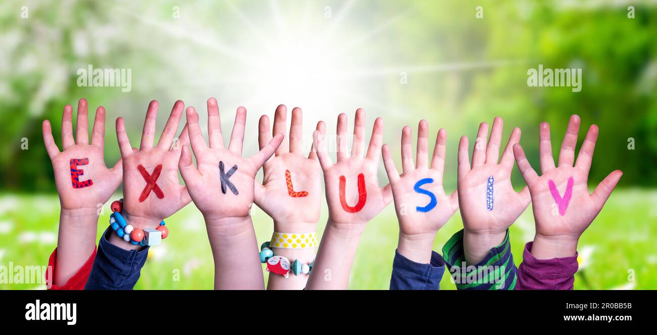 Children Hands Building Word Exklusiv means Exclusive, Grass Meadow ...
