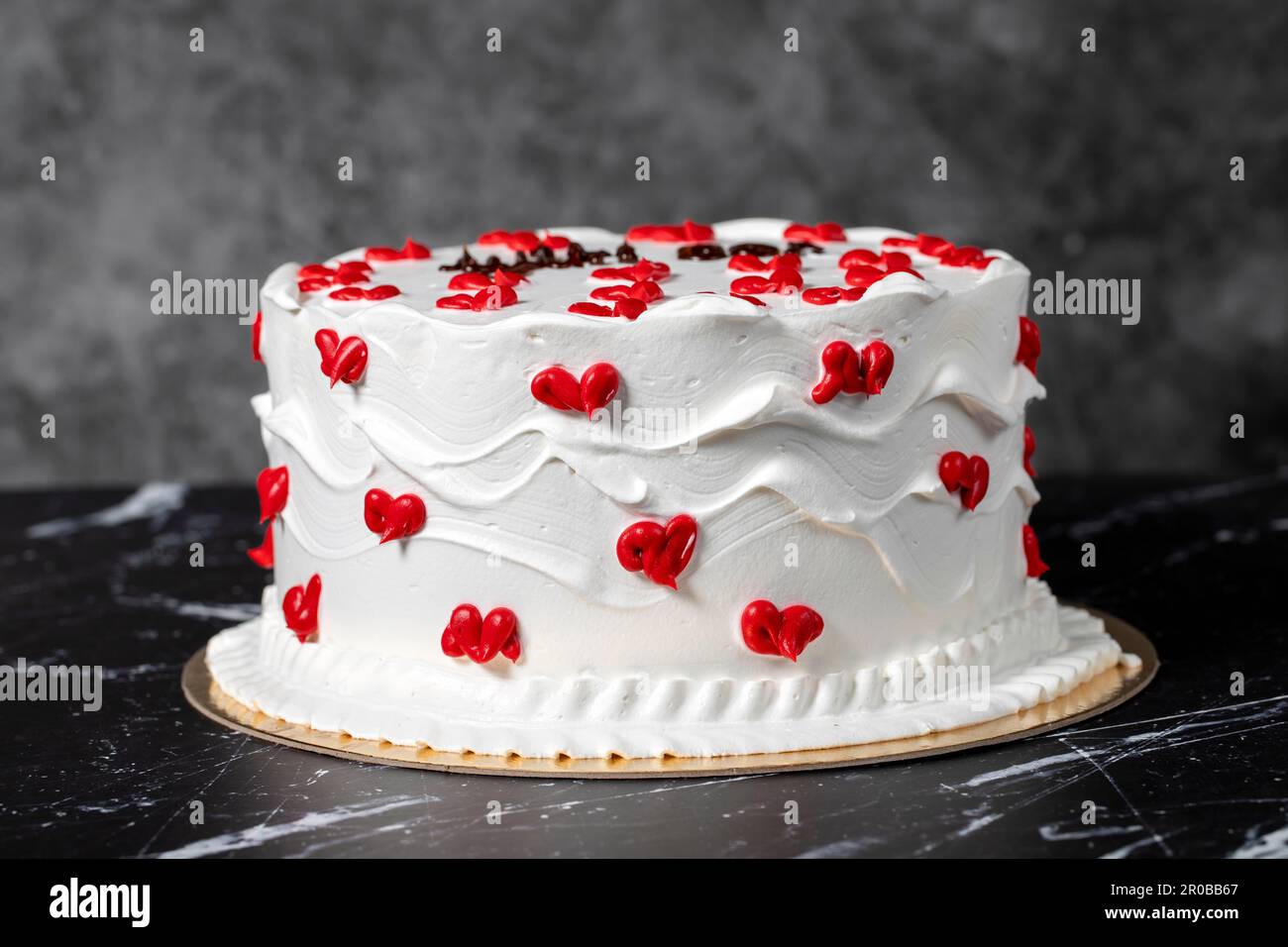 Cream cake. Homemade fruit and cream cake on a dark background. Close ...
