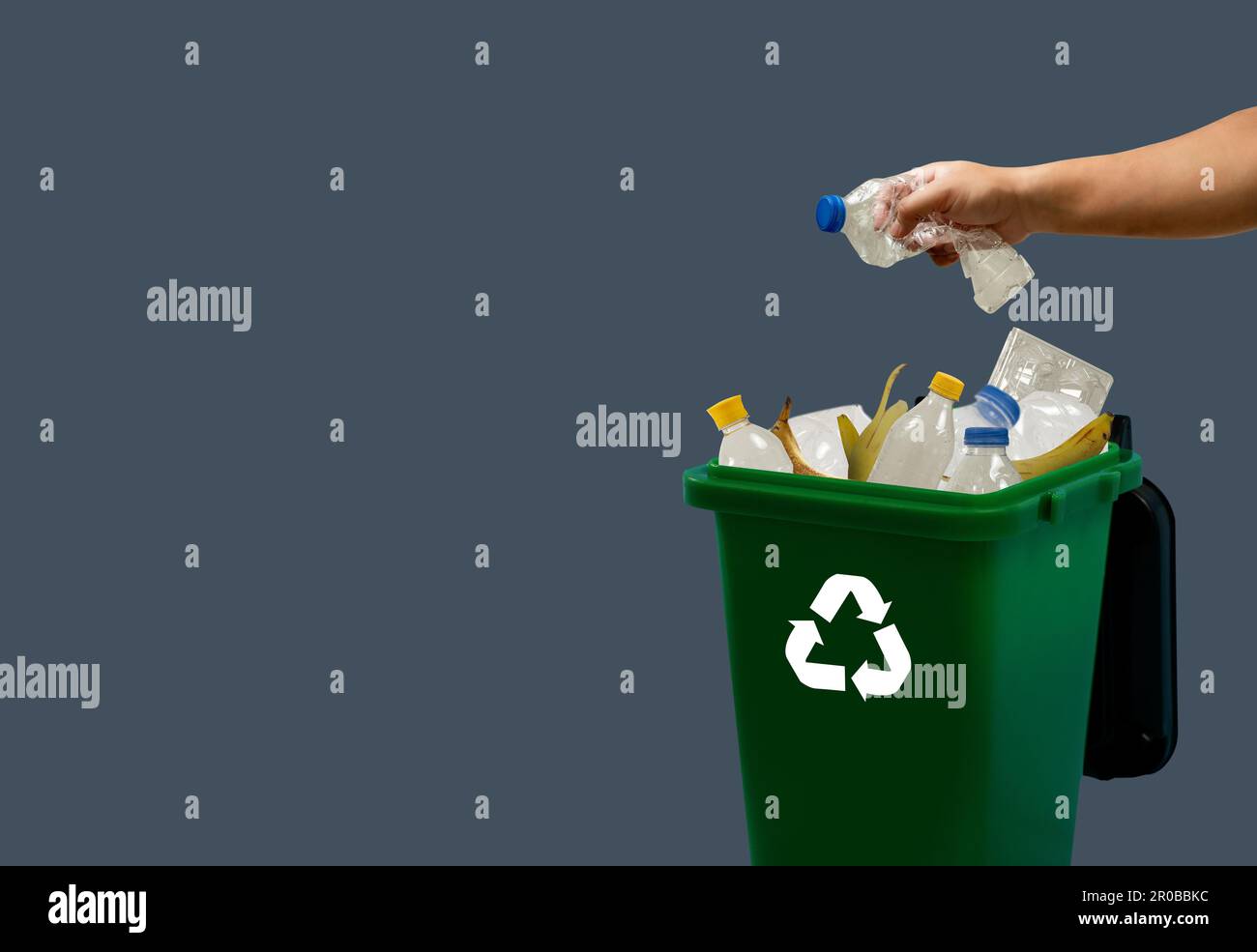 person hand holding garbage bag bag in to trash dump food environment ...