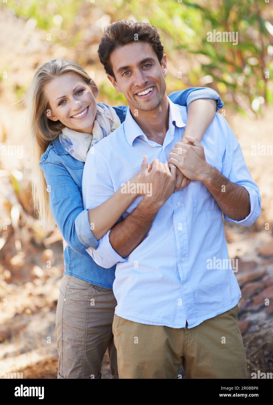Well always be together. a romantic young couple standing together ...