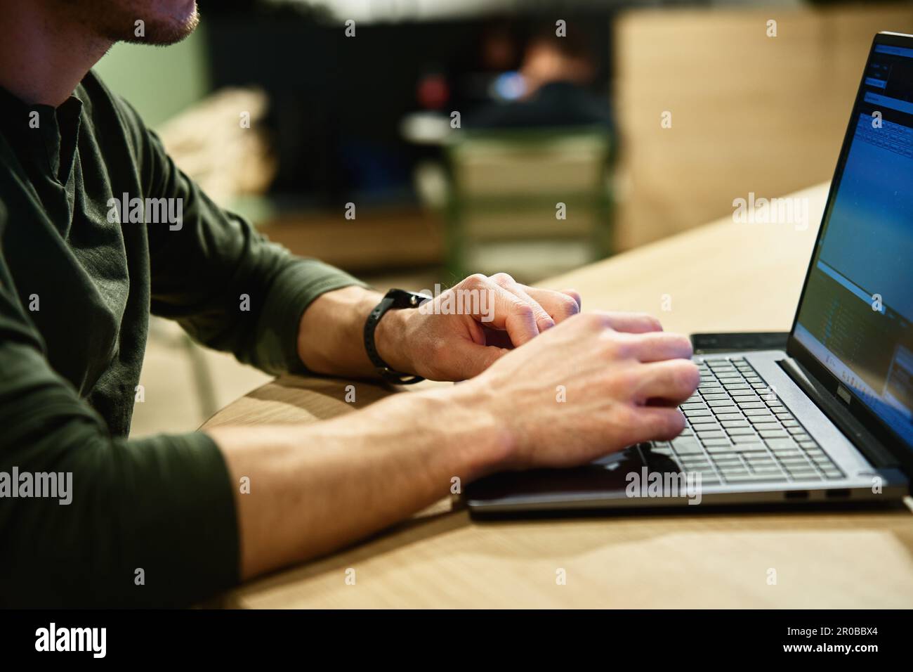 Male hands typing on laptop keyboard, close up. Man using laptop in office. Online work Stock ...