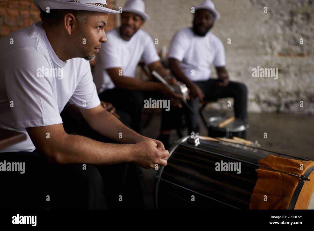 Percussion is their passion. band members sitting with their ...