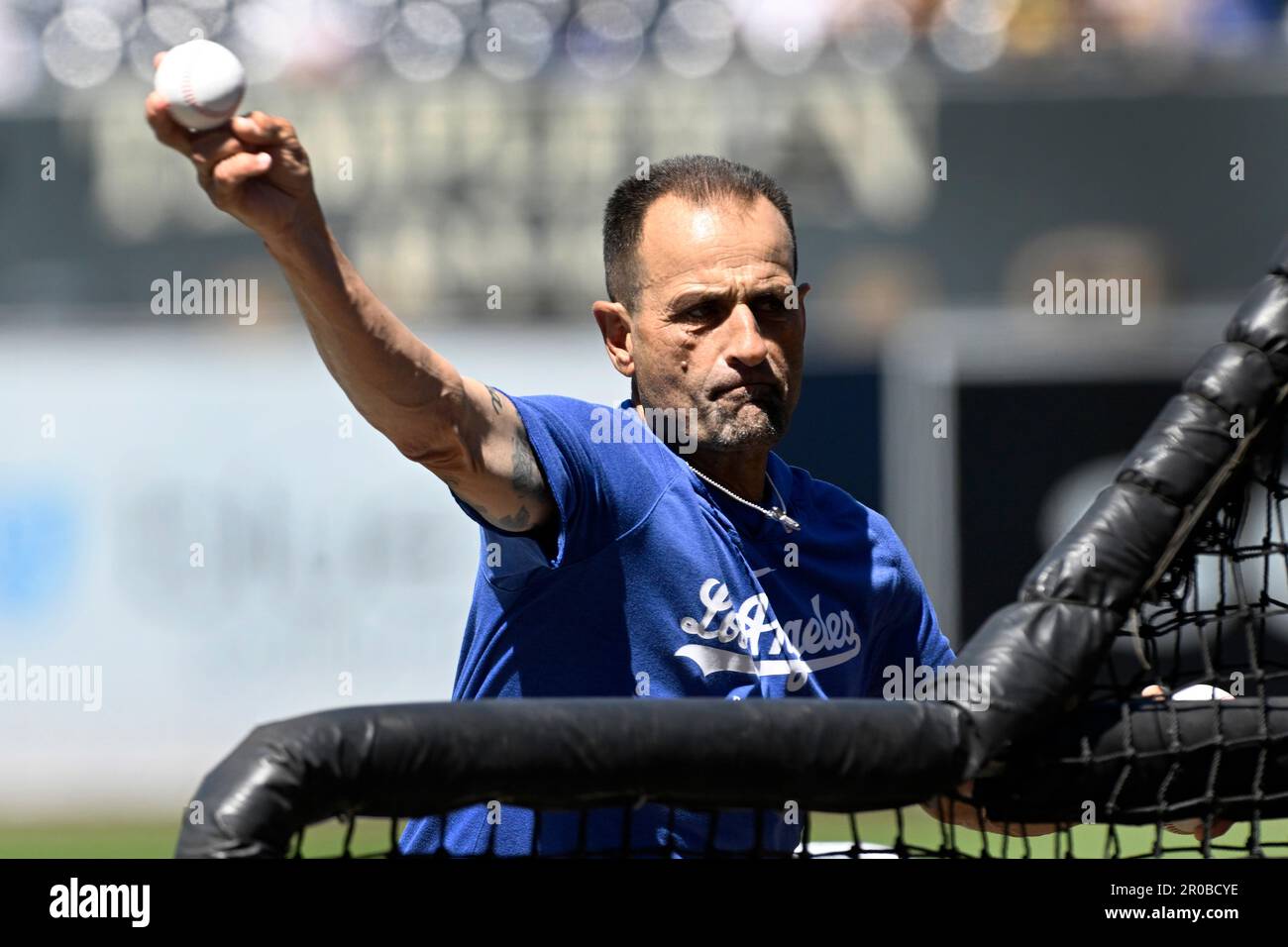 Los Angeles Dodgers third base coach Dino Ebel throws during warmups ...