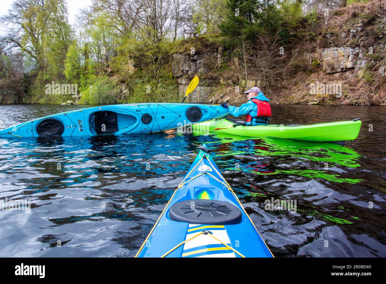 Sea kayakers practicing rescue techniques on a reservoir Stock Photo ...