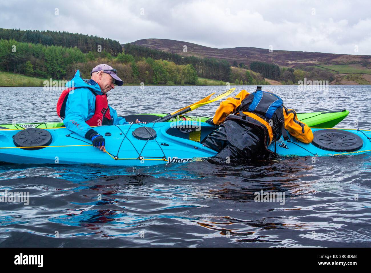 Sea kayakers practicing rescue techniques on a reservoir Stock Photo ...