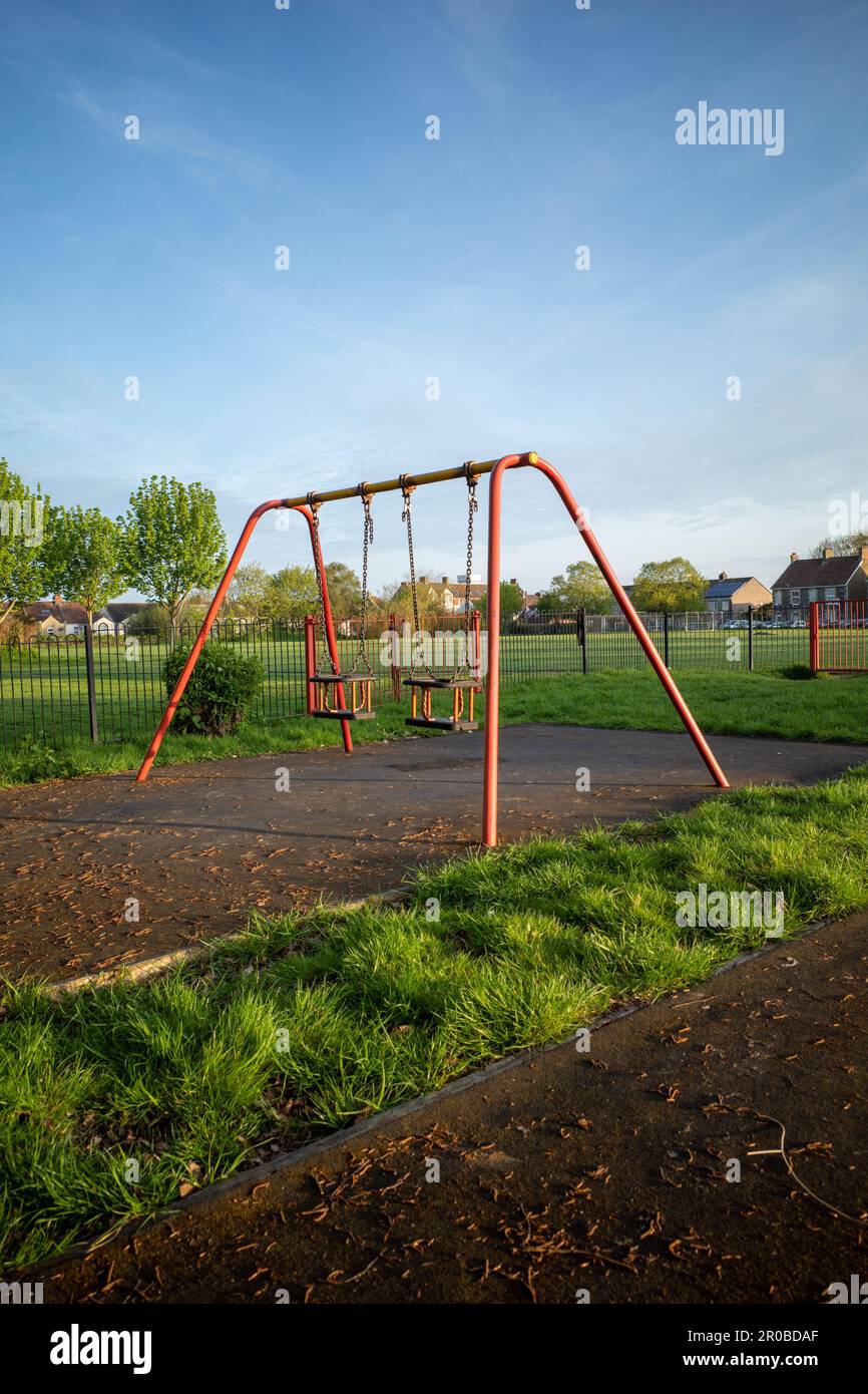 Playground swings at Court Road Play Area, Kingswood, Bristol, UK Stock ...