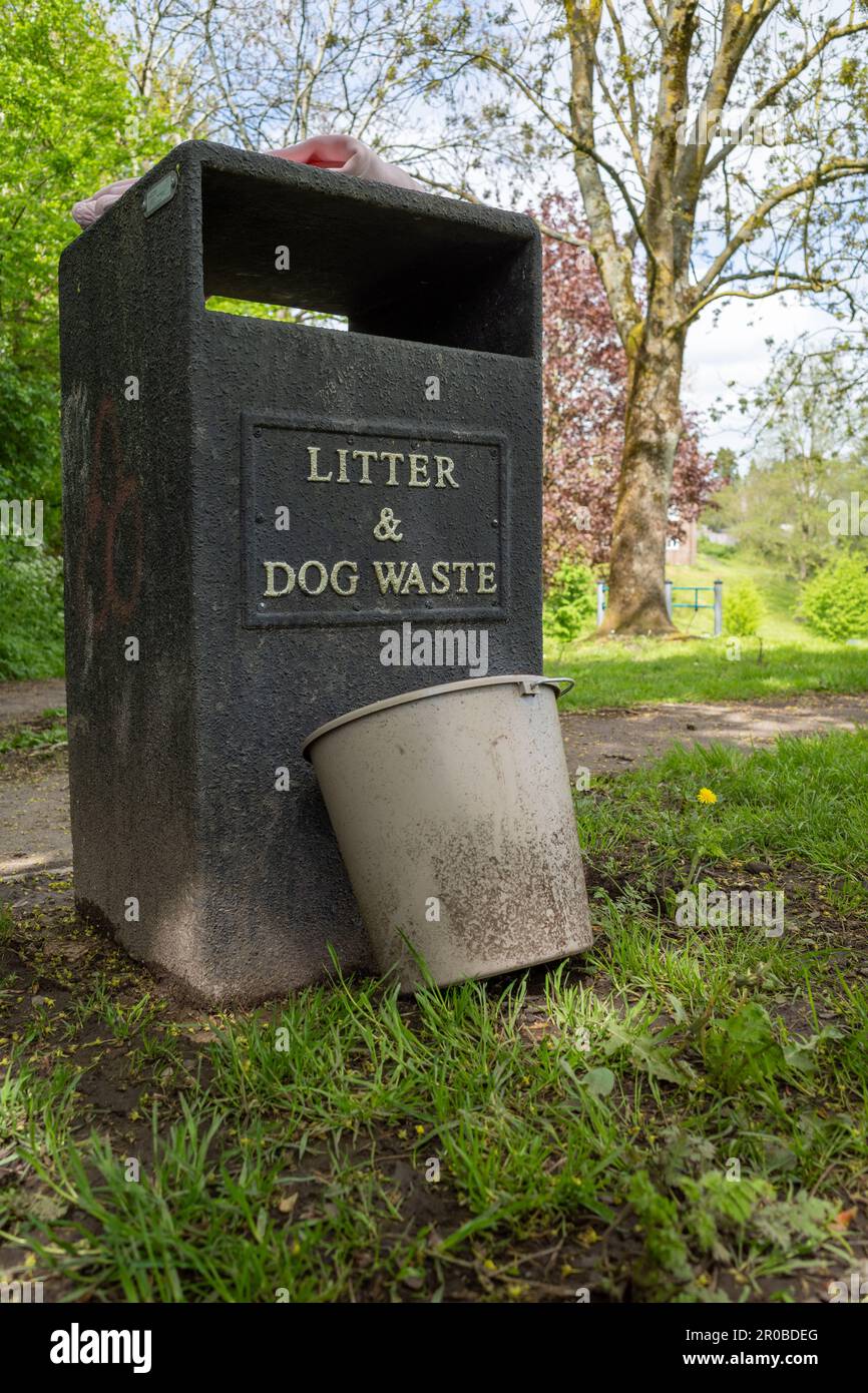 Black litter bin and bucket Stock Photo - Alamy