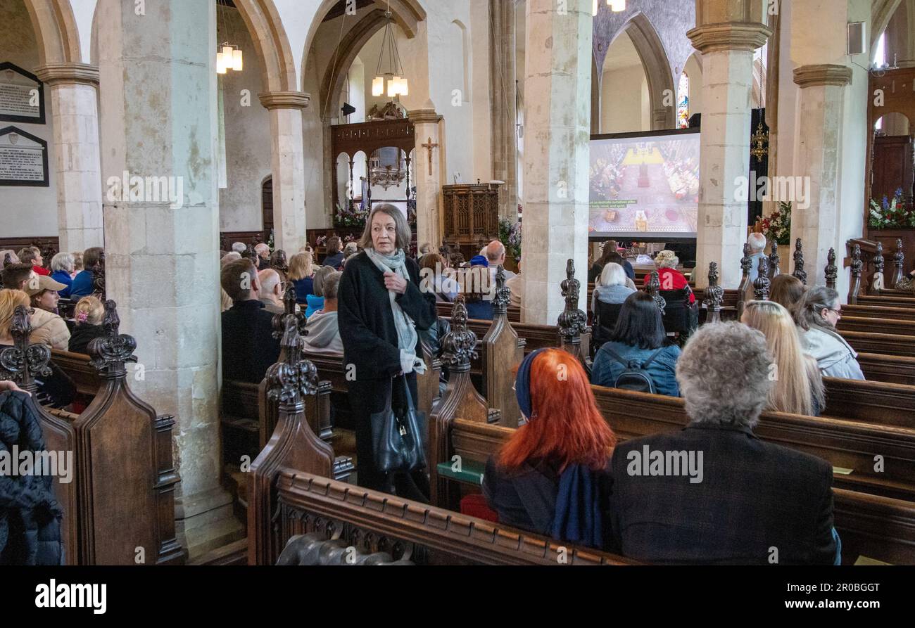 People seated in St Michael's church Framlingham Suffolk and watching ...