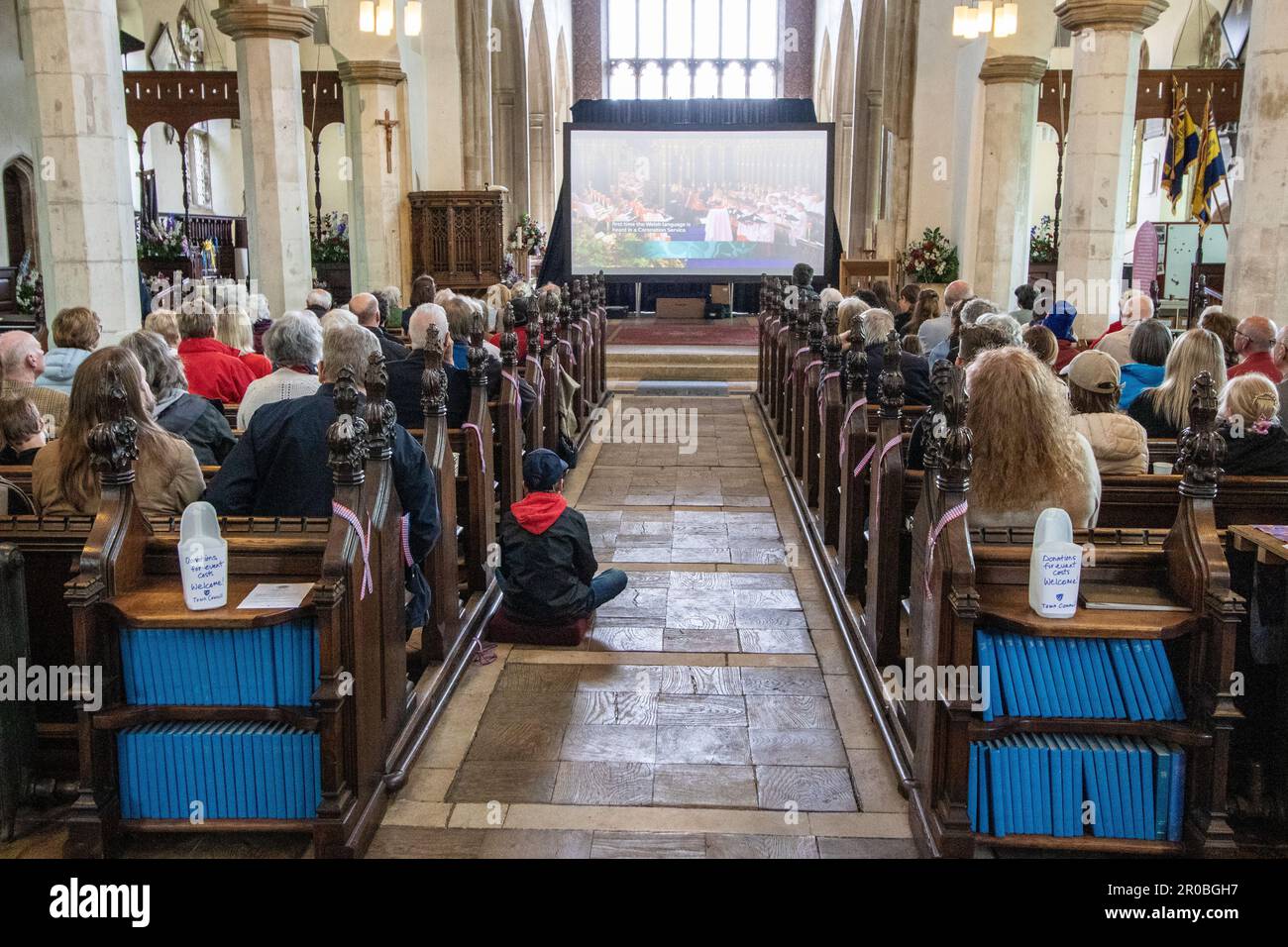 People seated in St Michael's church Framlingham Suffolk and watching ...