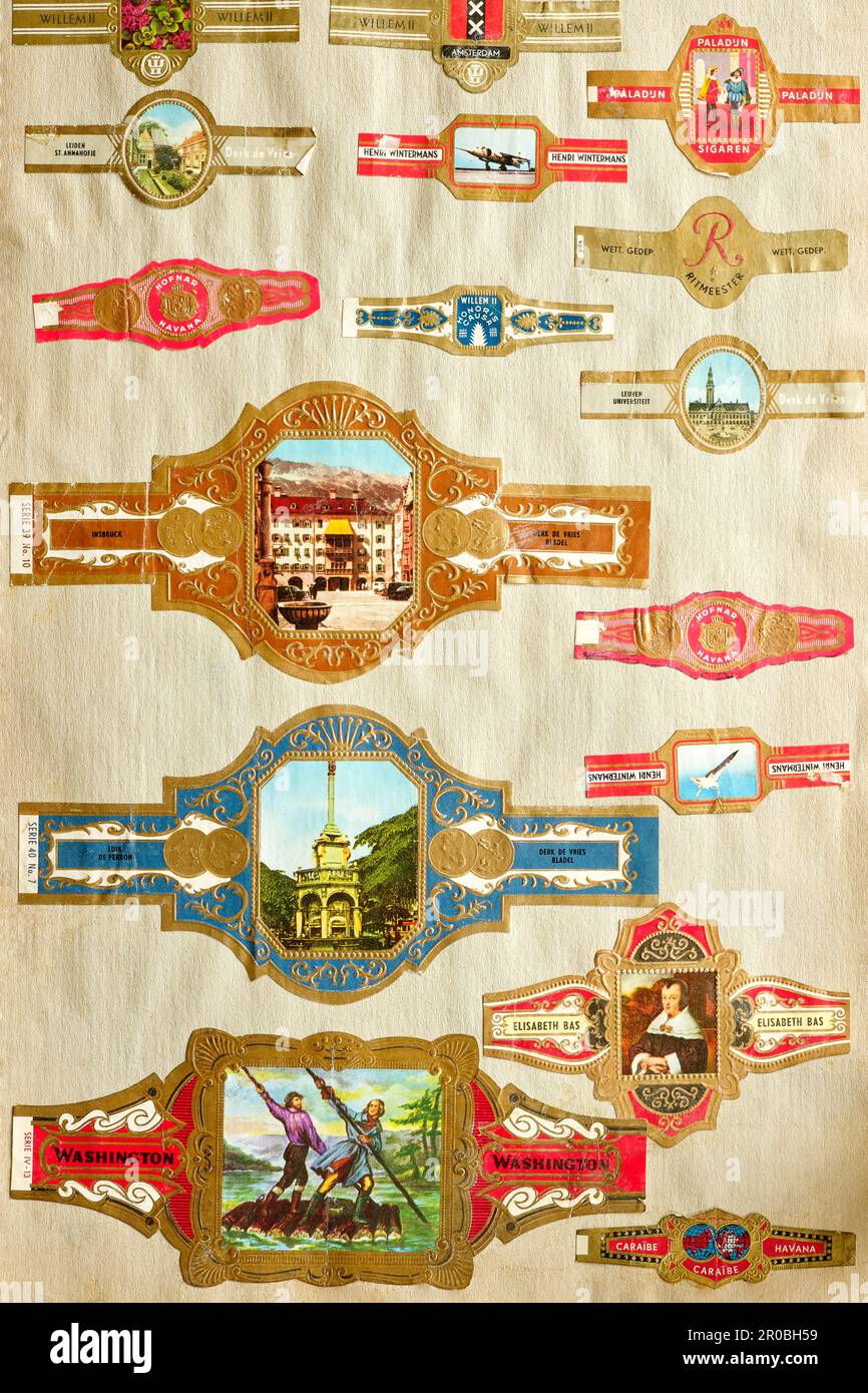 A collection of cigar bands in an old retro scrapbook with dutch brands ...