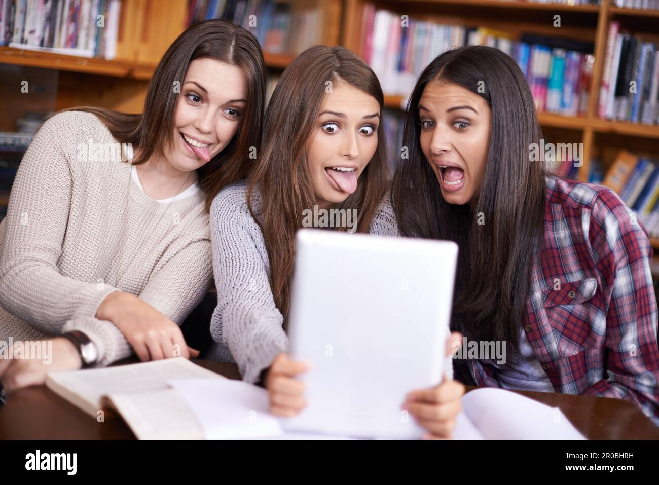 Too much studying can do strange things. three friends sitting in the ...