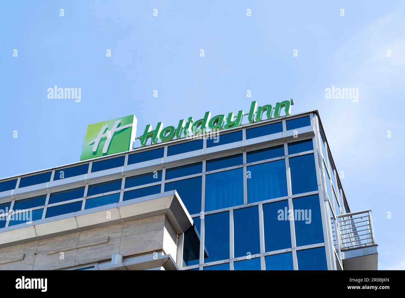 Holiday Inn hotel building with logo sign. Krakow City Centre IHG hotel ...