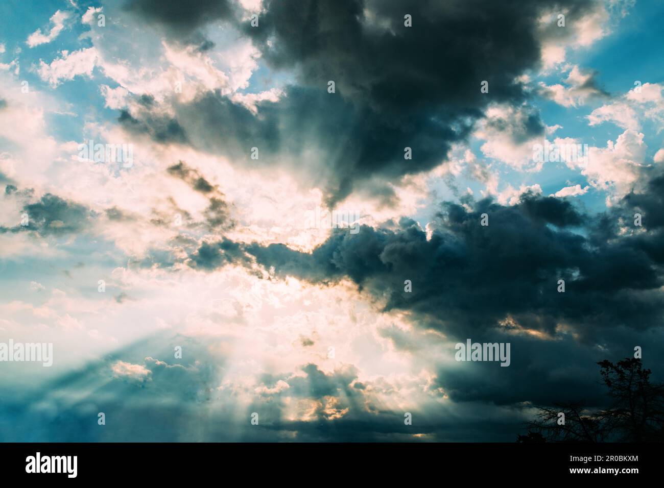 Clouds Bursting with Light Rays Stock Photo - Alamy