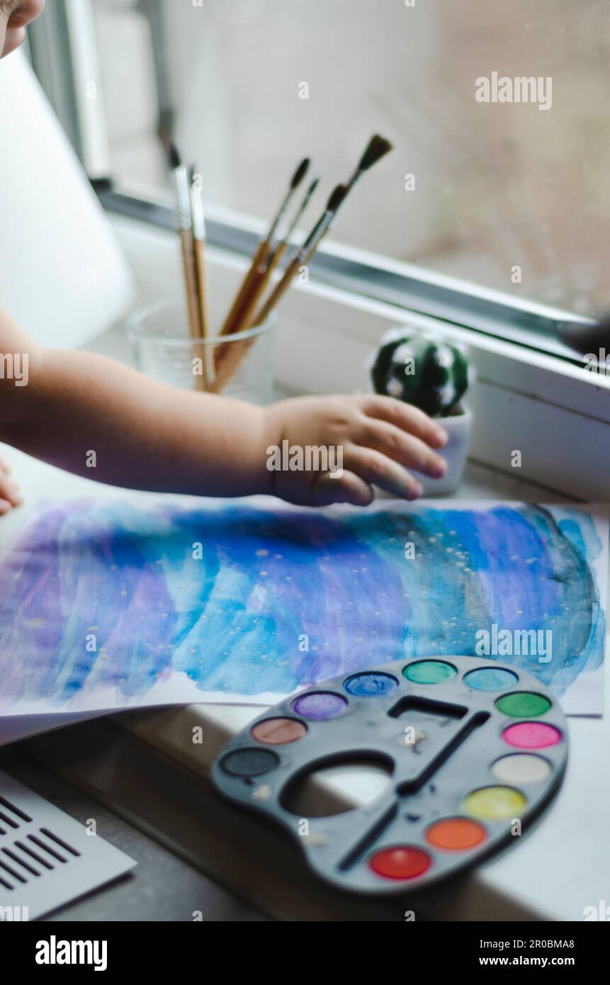 children's hand to draw with paints Stock Photo - Alamy