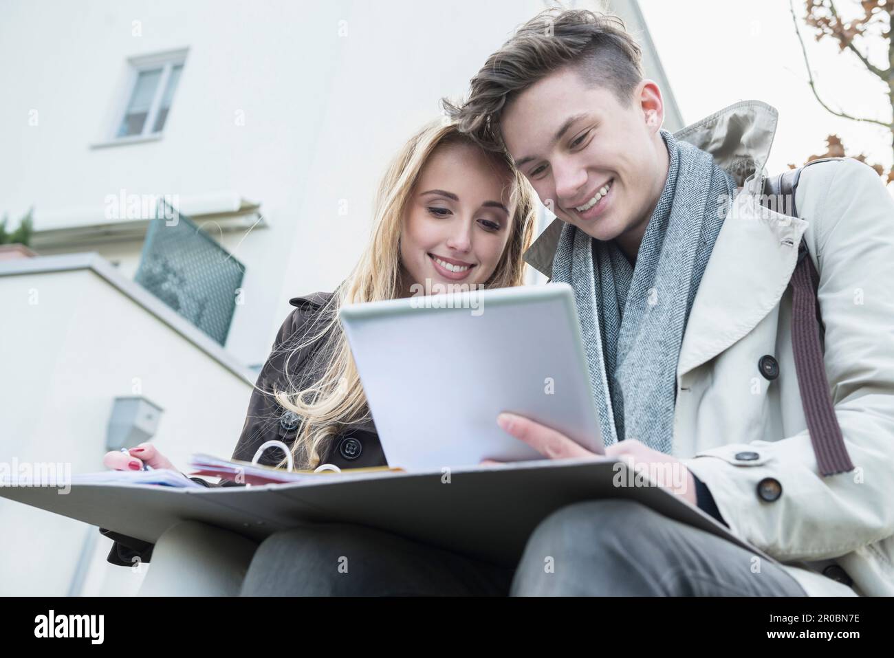University students working with digital tablet and folder, Munich ...