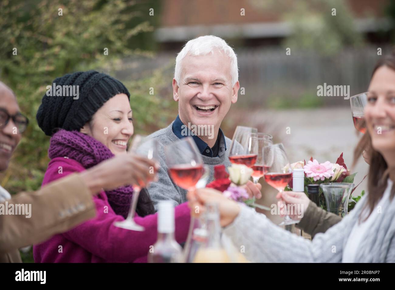 Family and friends enjoying outdoor party at farmhouse, Bavaria ...