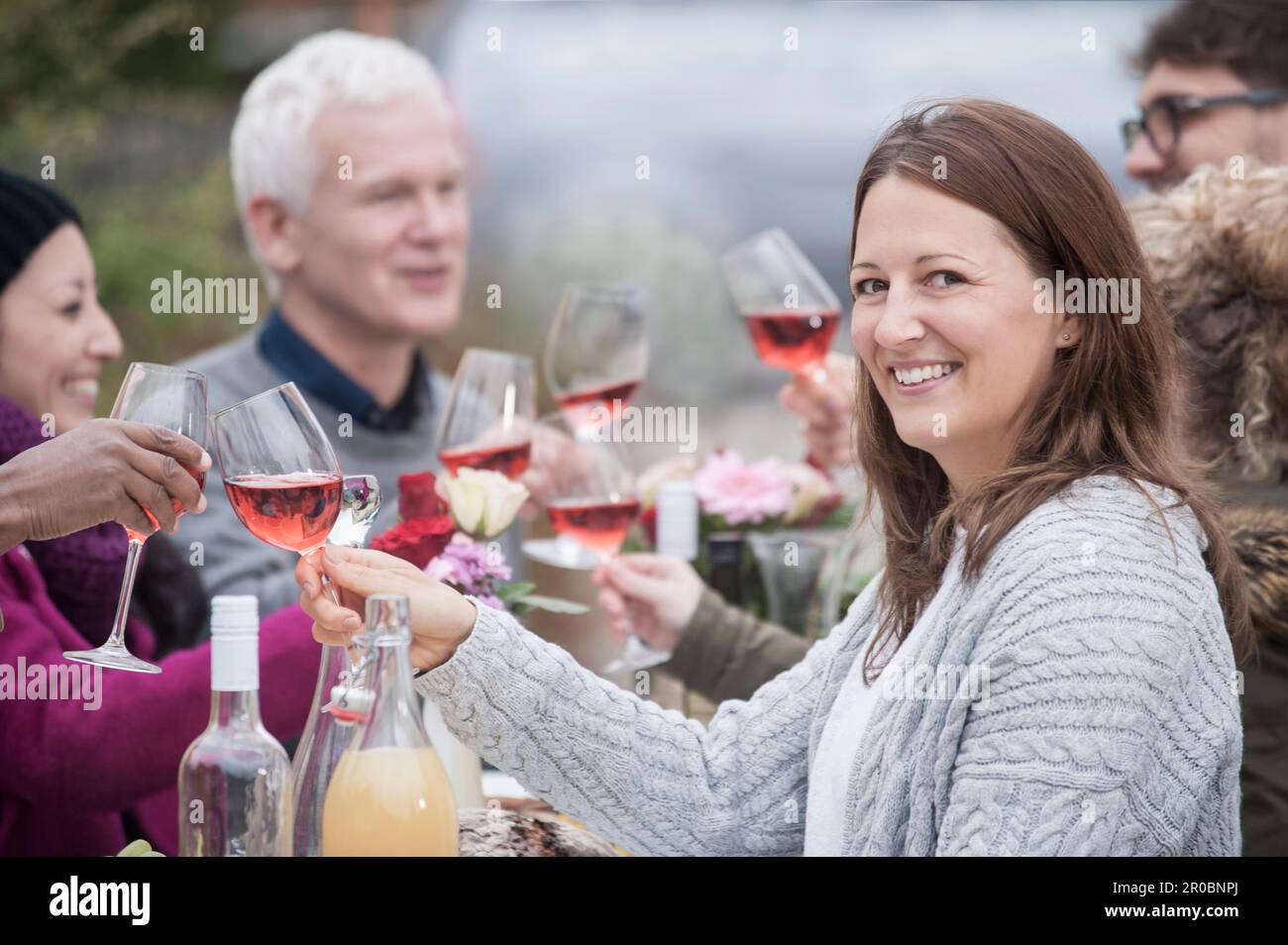 Family and friends enjoying outdoor party at farmhouse, Bavaria ...