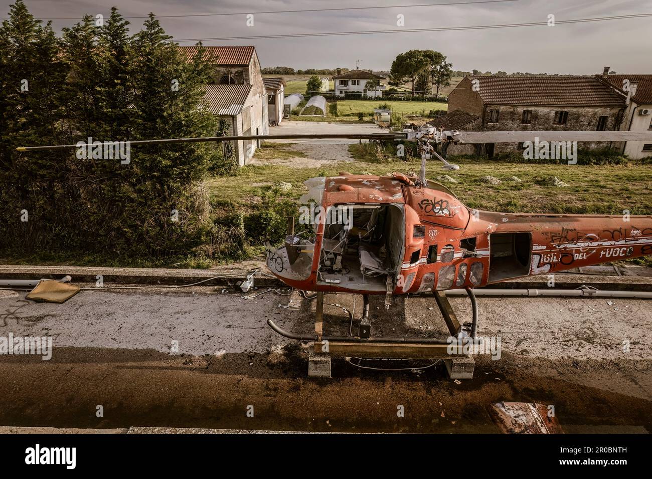 A striking image of an old helicopter left to decay and vandalized ...