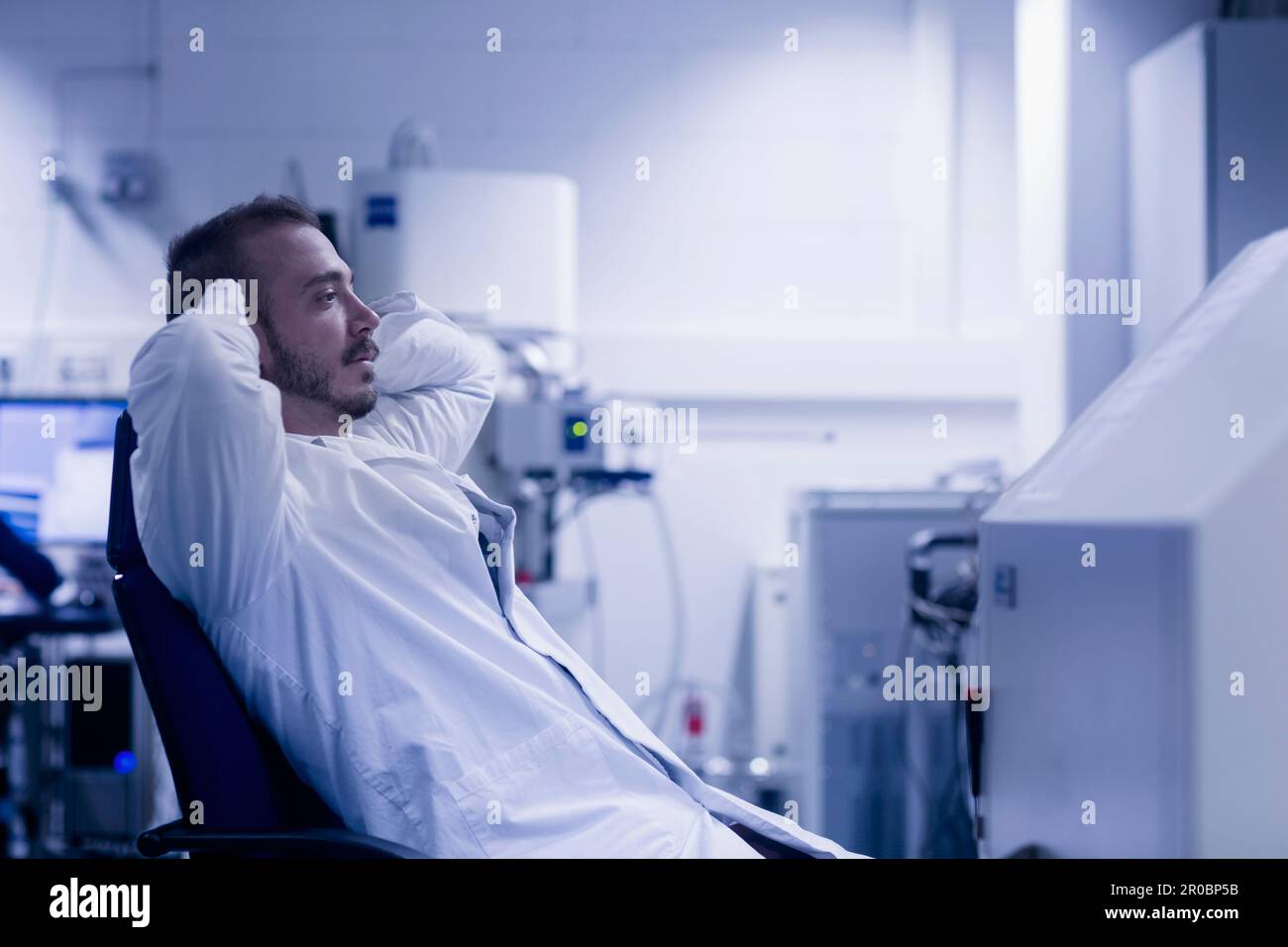 Male scientist sitting on chair hi-res stock photography and images - Alamy